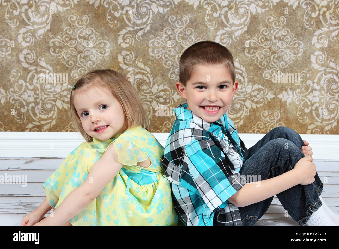 Adorable little brother and Sister on studio background Stock Photo - Alamy