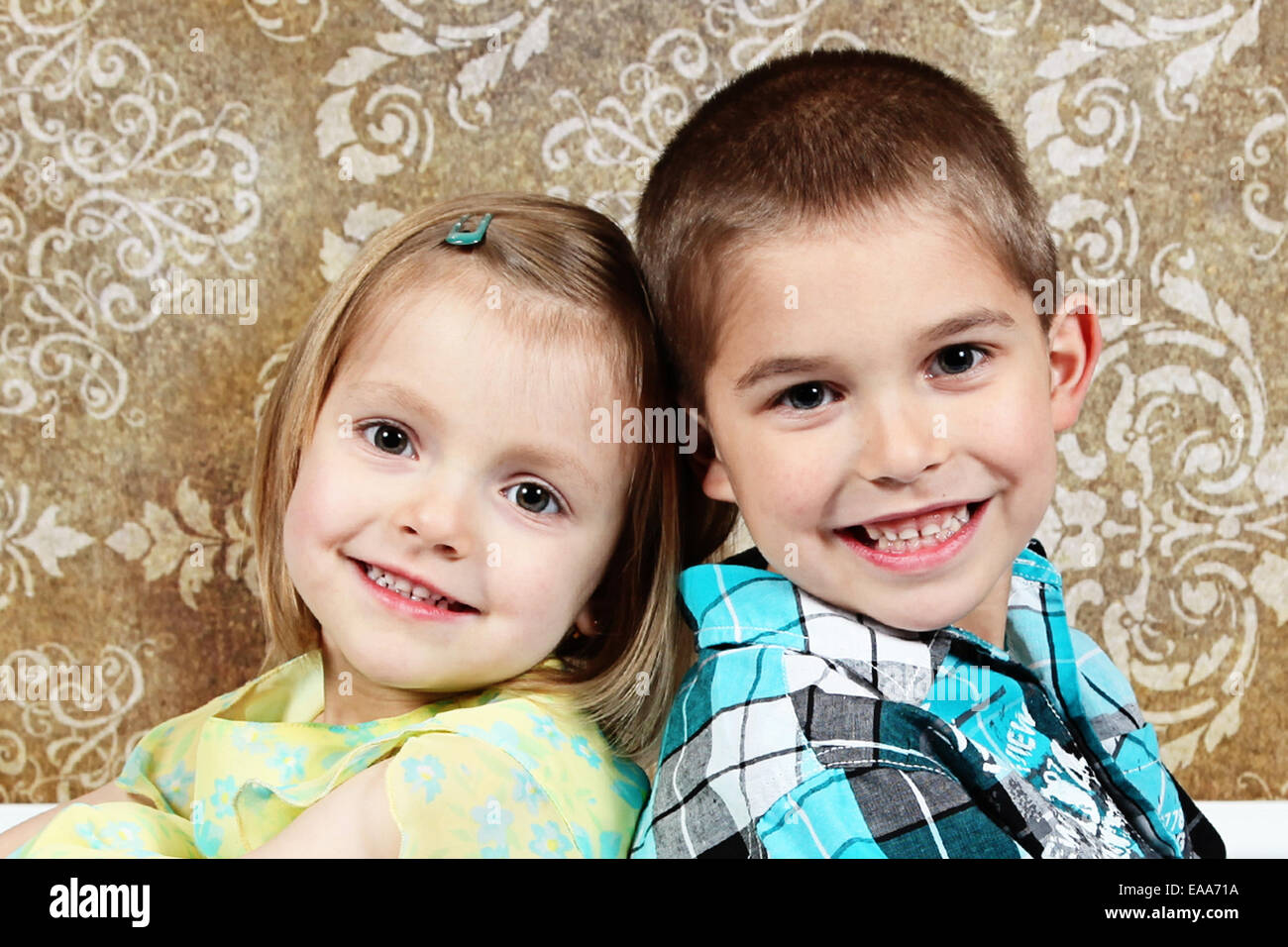 Adorable little brother and Sister on studio background Stock Photo - Alamy