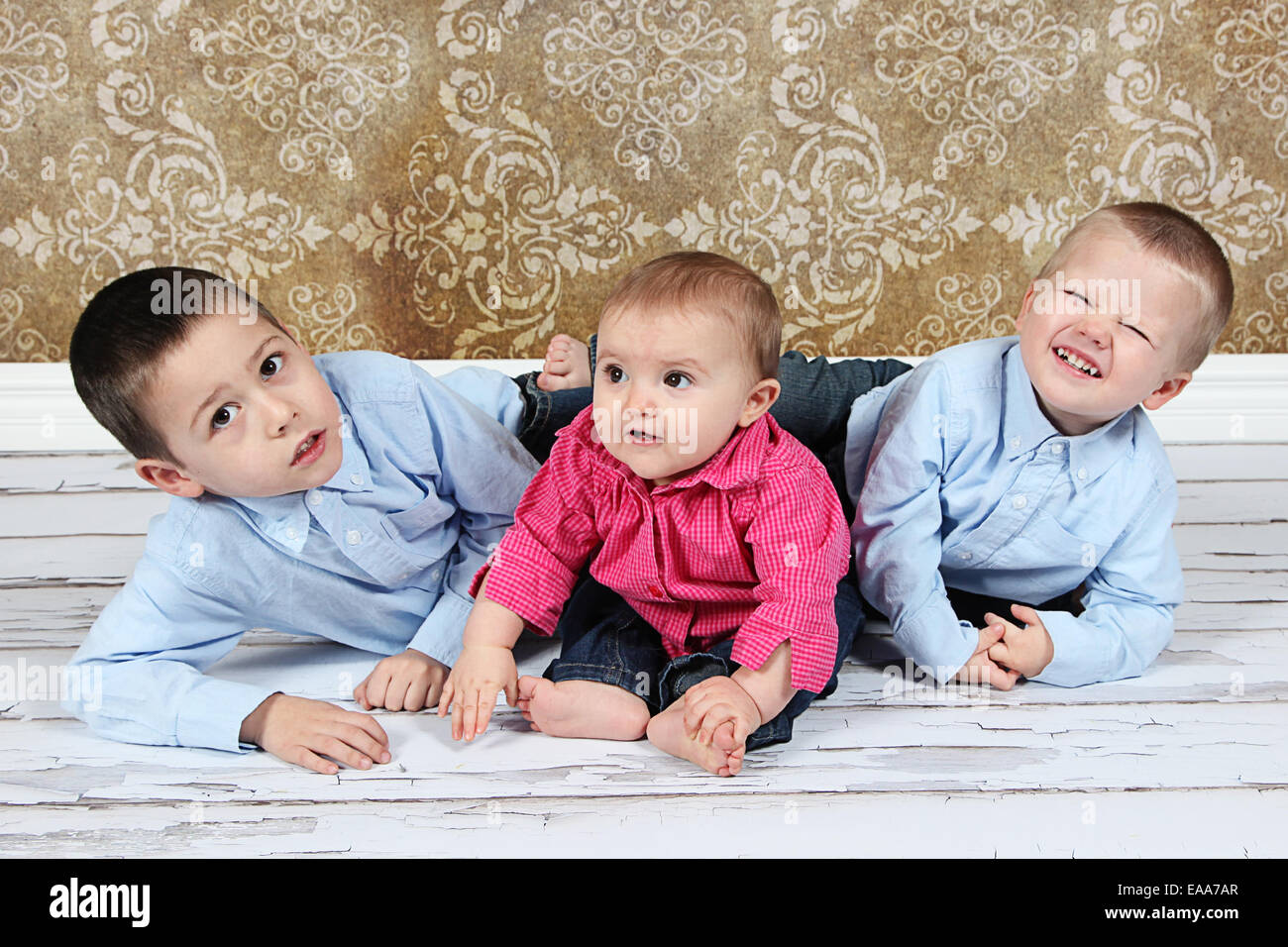 Three Children posing in Studio - Brothers and Sisters Stock Photo - Alamy