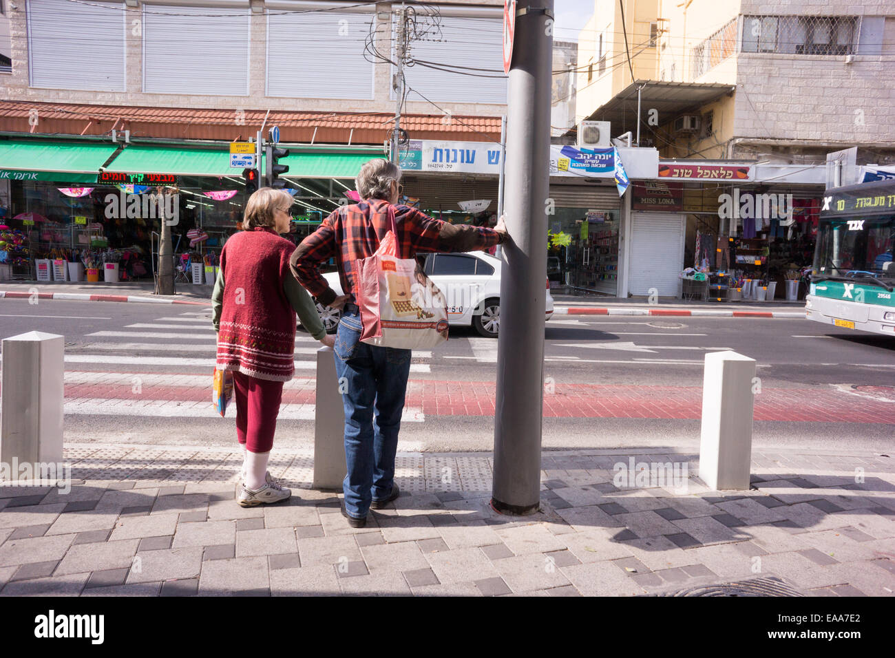 Busy street scenes in Haifa, Israel, with pedestrians, shops, and urban ...