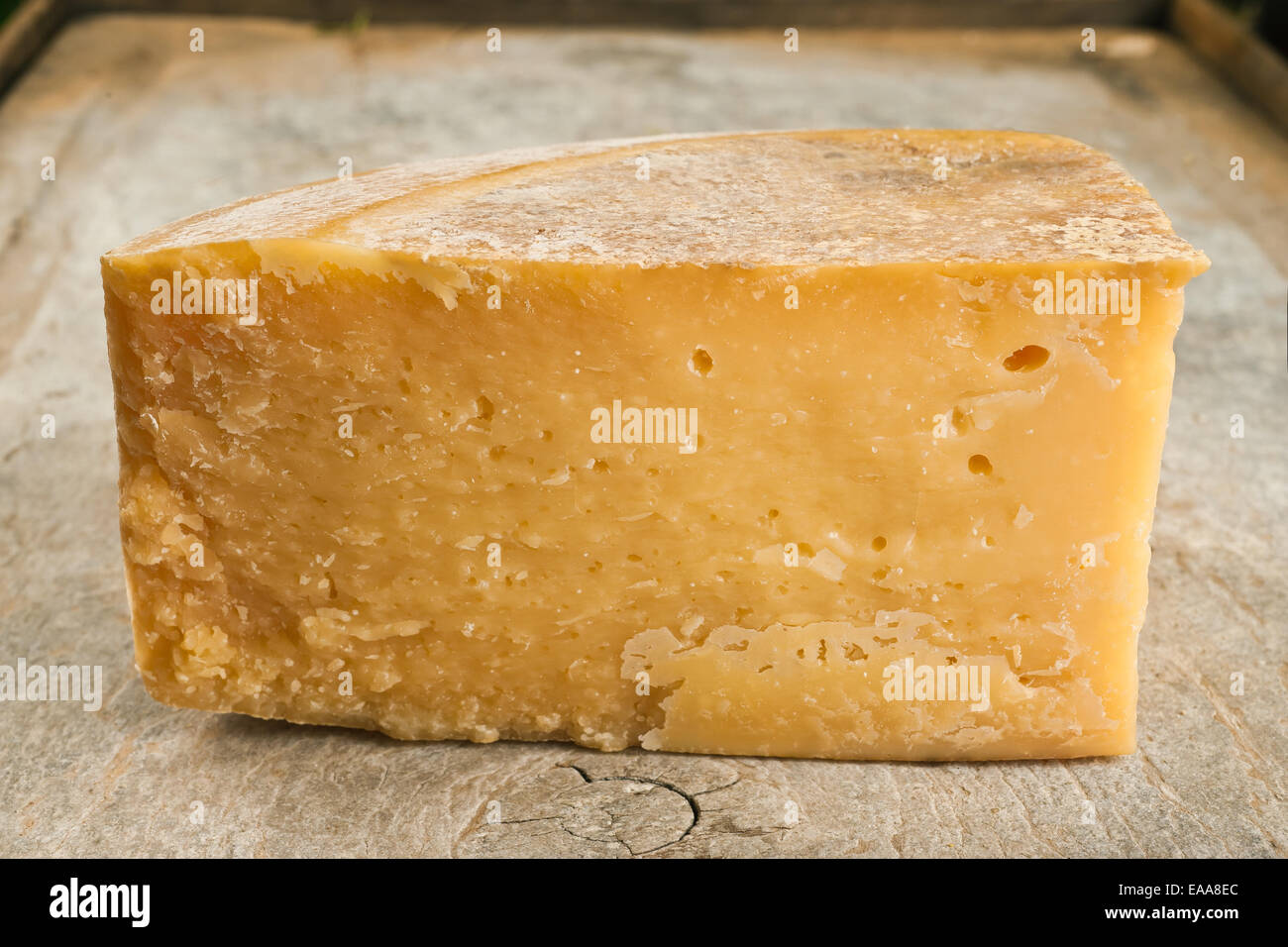 slice of aged cheese Stock Photo - Alamy