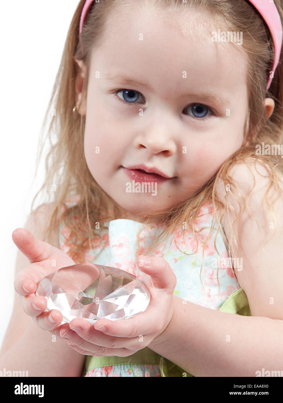 Adorable little girl hold Diamond isolated on white background Stock ...