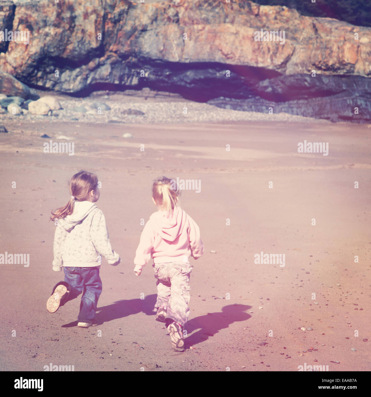 kids walking on a path by beach Stock Photo - Alamy