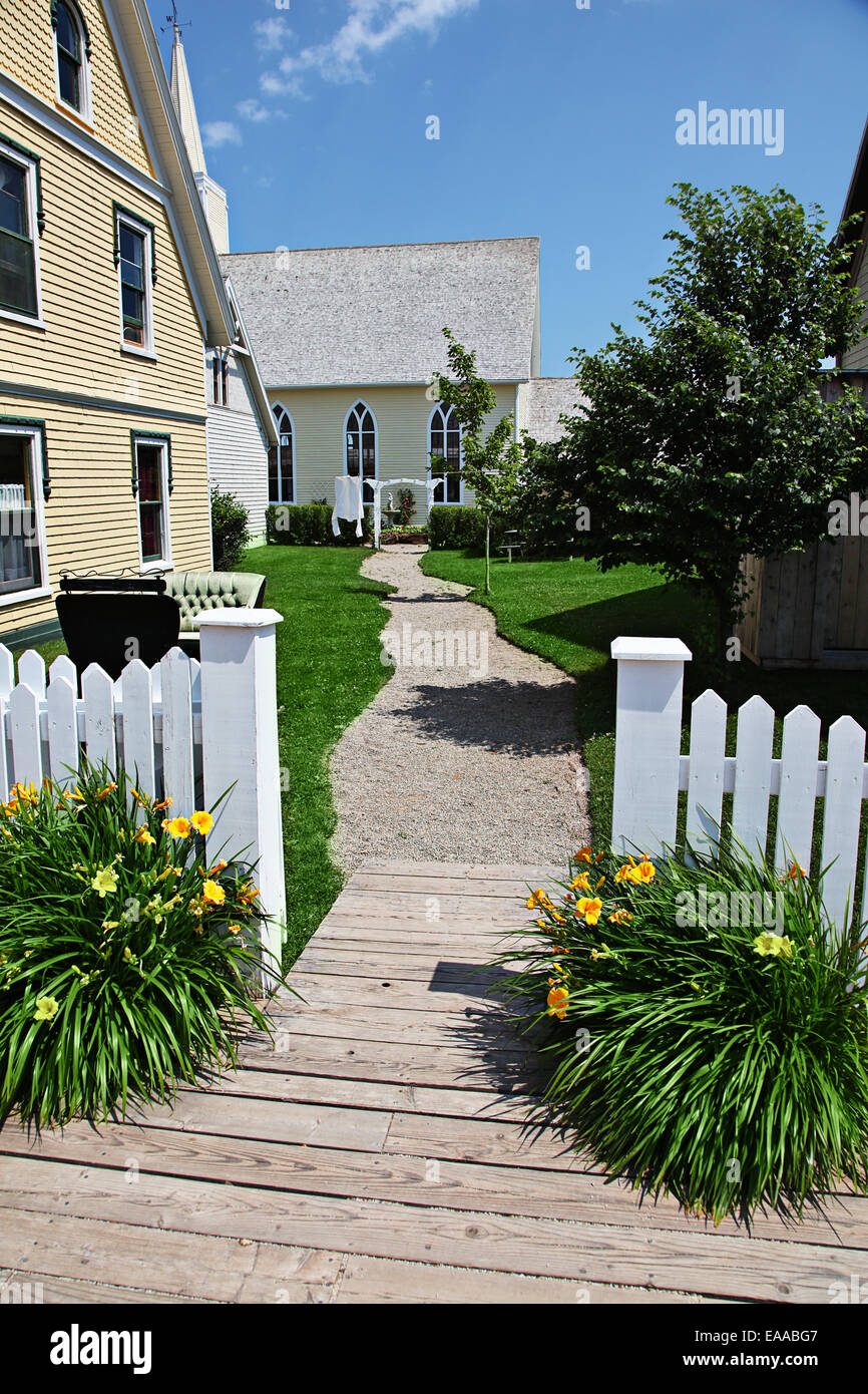 Beautiful old yellow house in summer Stock Photo - Alamy