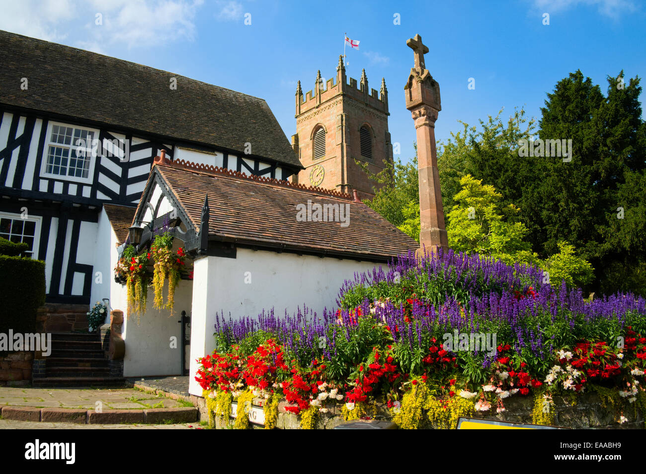 All Saints parish church and cross, Claverley, Shropshire, England, UK ...