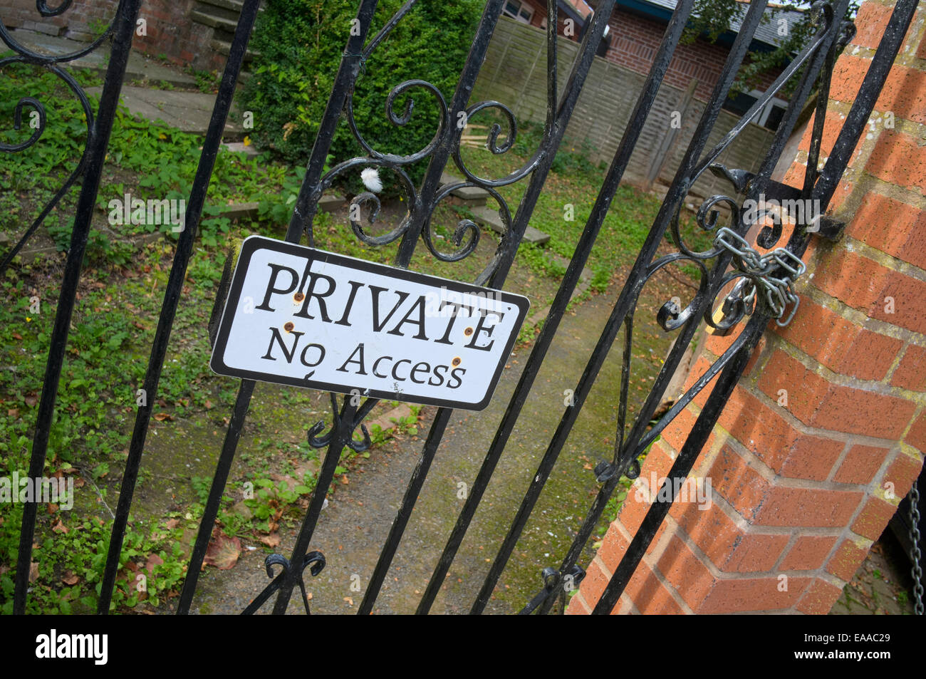 Private no access sign on a padlocked wrought iron gate, West Midlands ...