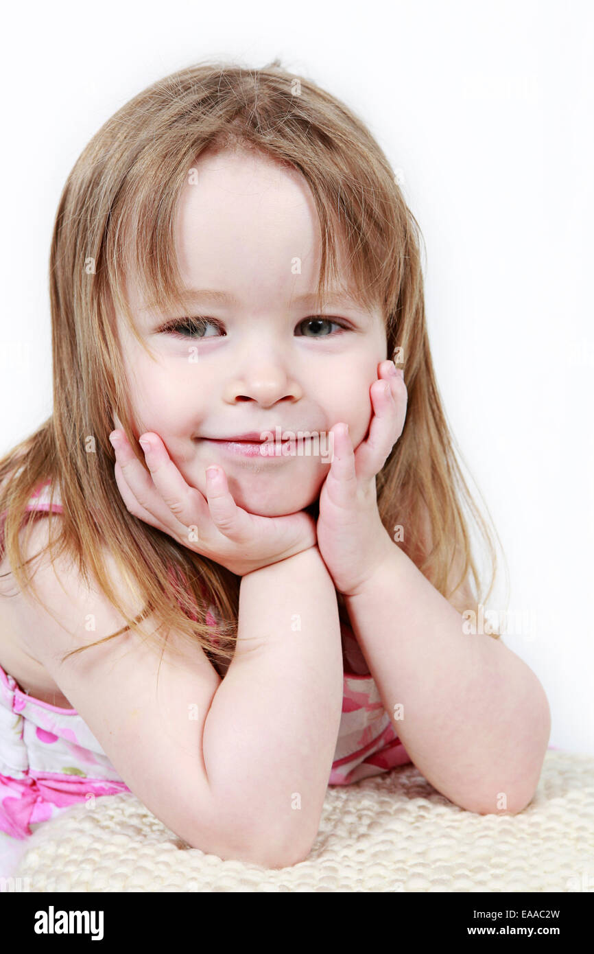 Litter girl posing for camera, taken closeup Stock Photo - Alamy