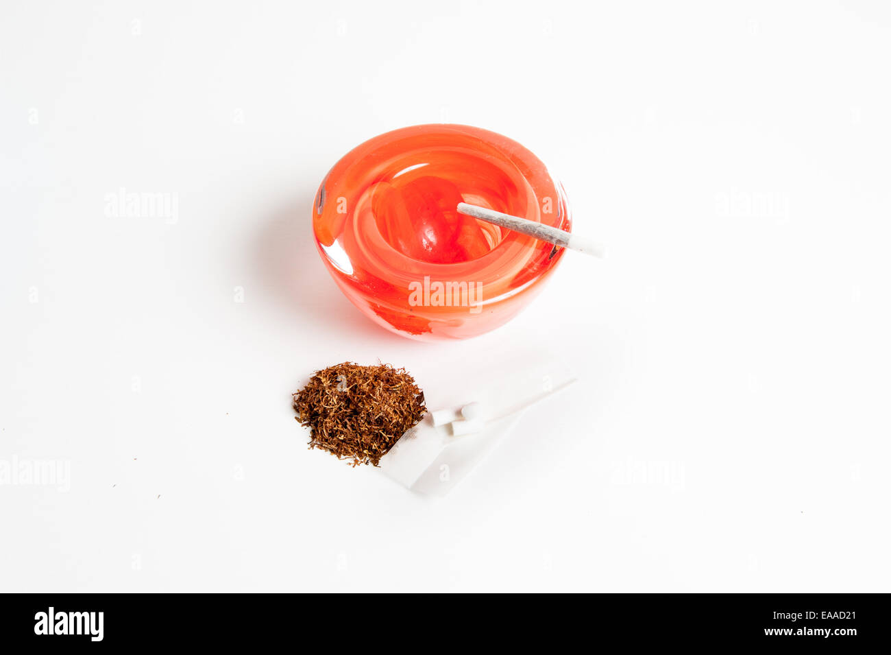 Tobacco, filters and cigarette paper ready for an handmade cigarette ...