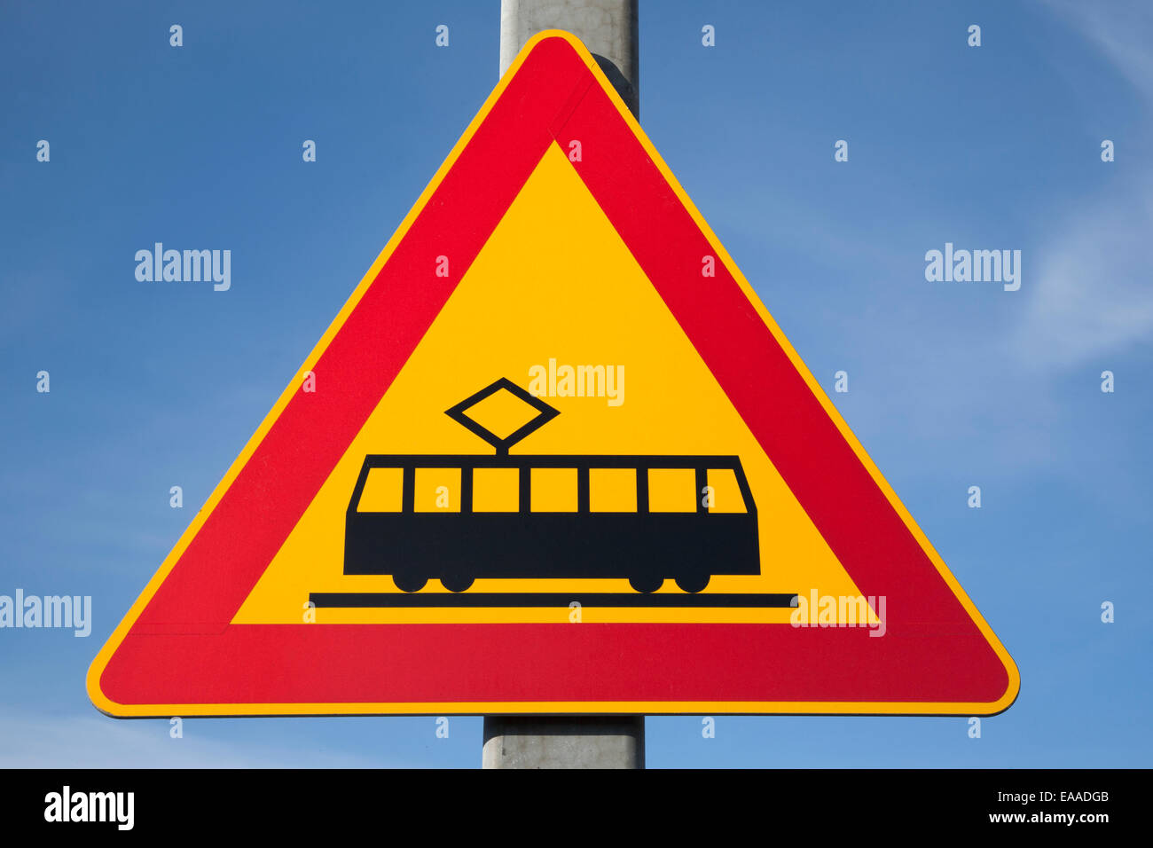 Red and Yellow Tram Sign against Blue Sky Background Stock Photo - Alamy