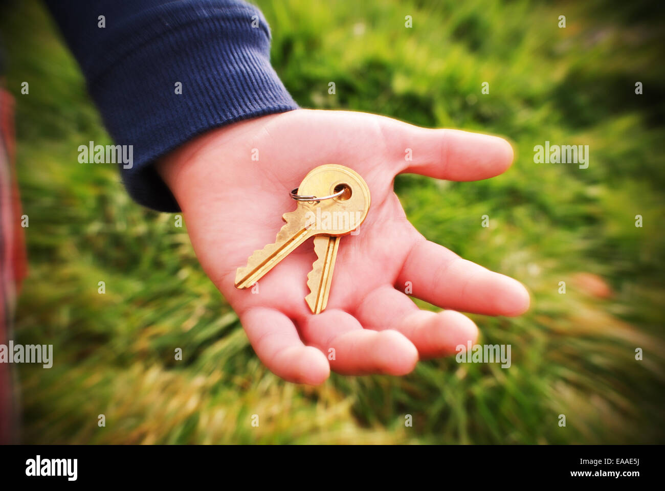 child holding key in his hand Stock Photo - Alamy