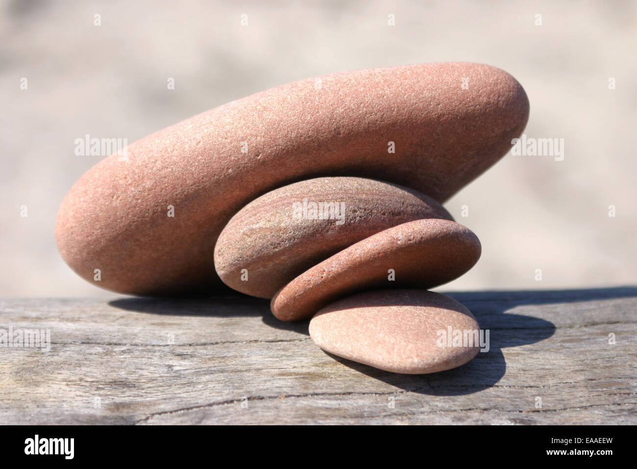 Pile of pebble stones pressing each other and collapsing Stock Photo ...