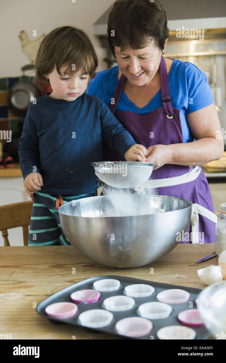 Boys making cakes hi-res stock photography and images - Alamy