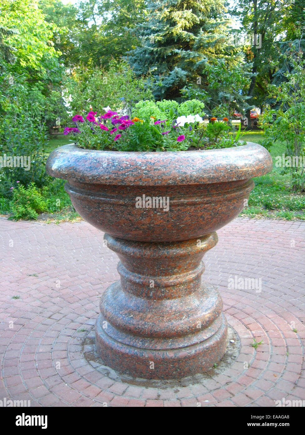 beautiful flowers on the flower-bed made from marble Stock Photo - Alamy
