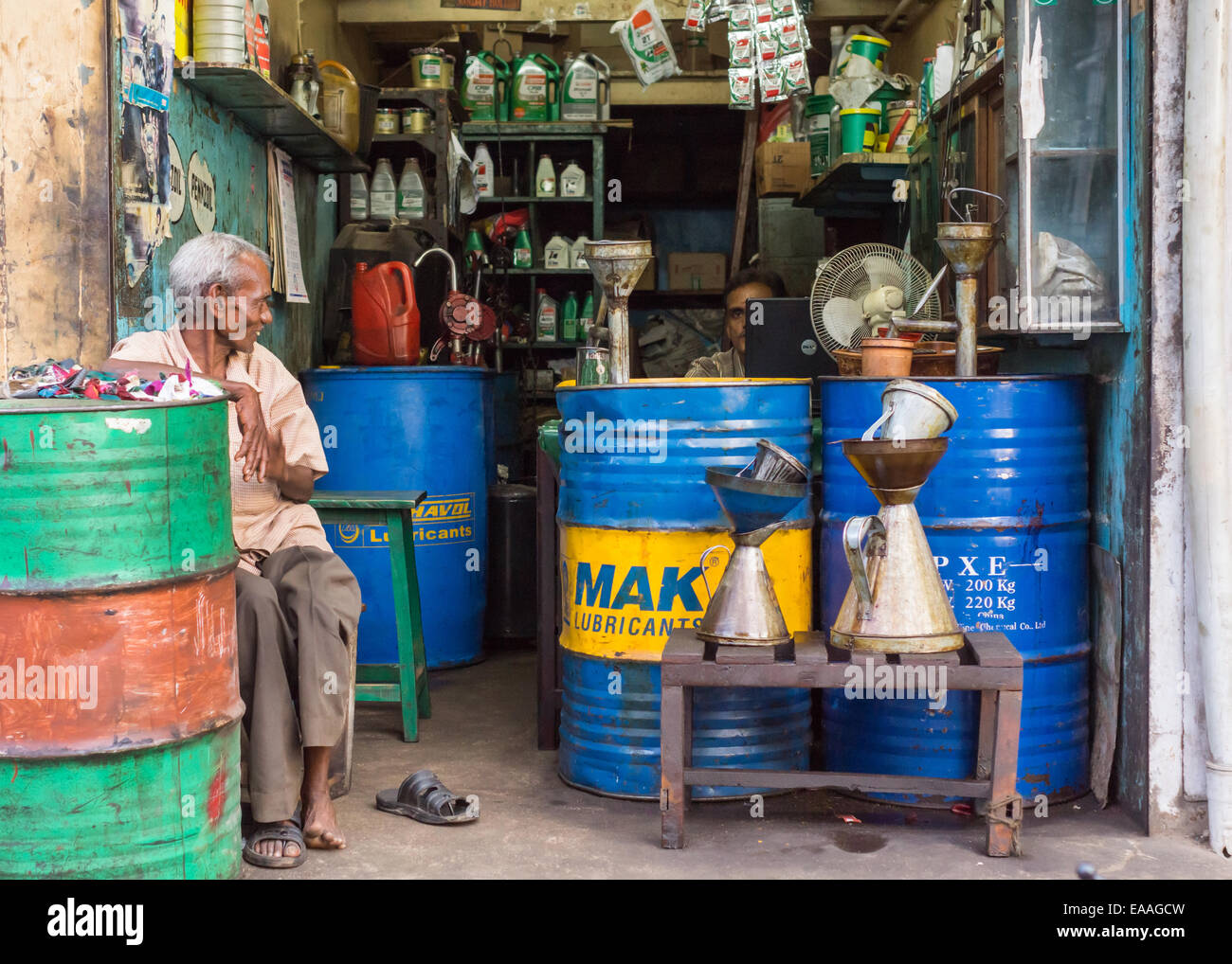 Petrol and oil shop in the middle of town Stock Photo - Alamy
