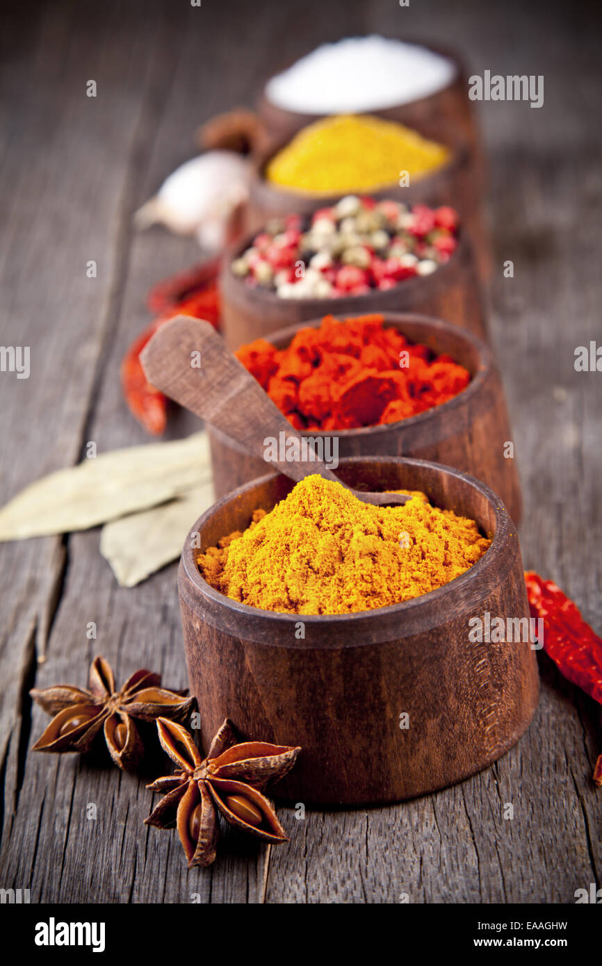 Various kind of spices in wooden bowls Stock Photo - Alamy
