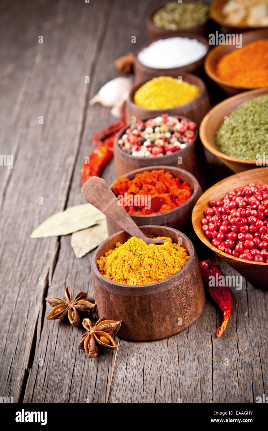 Various kind of spices in wooden bowls Stock Photo - Alamy