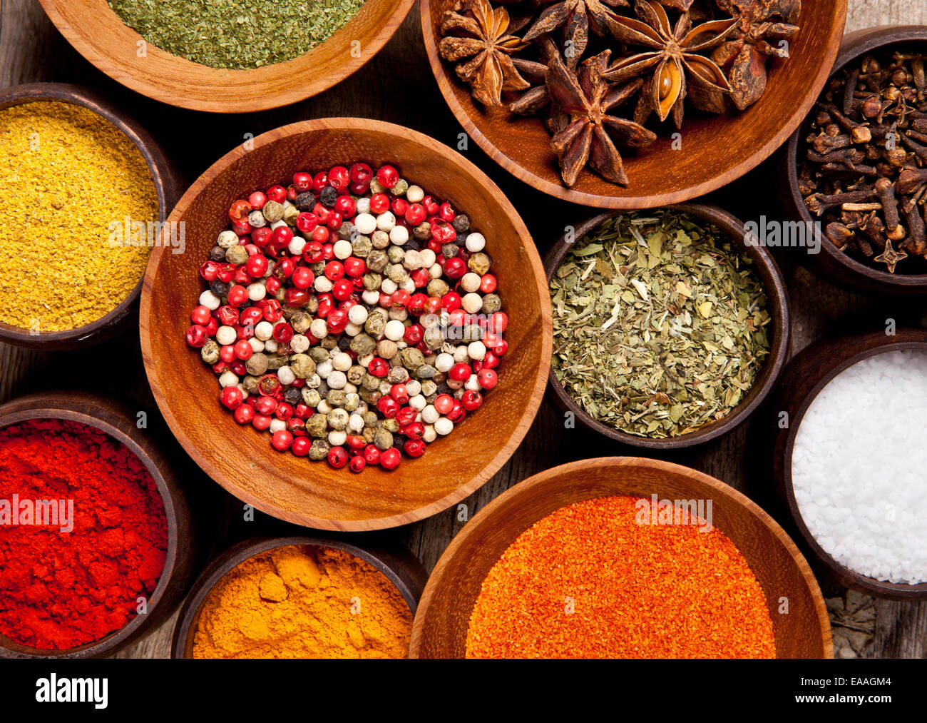Various kind of spices in wooden bowls Stock Photo - Alamy