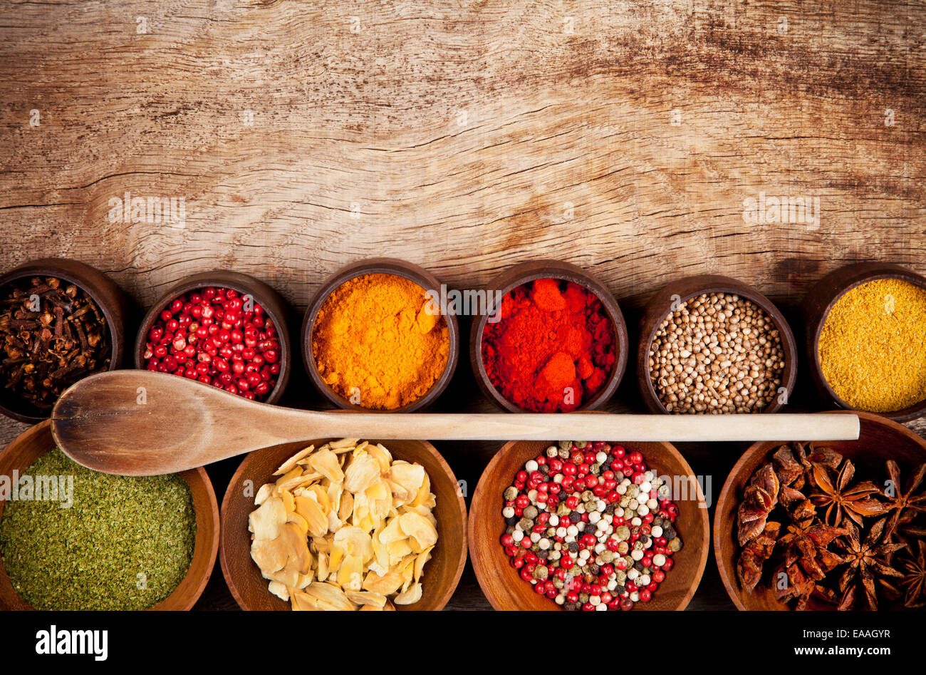 Various kind of spices in wooden bowls Stock Photo - Alamy