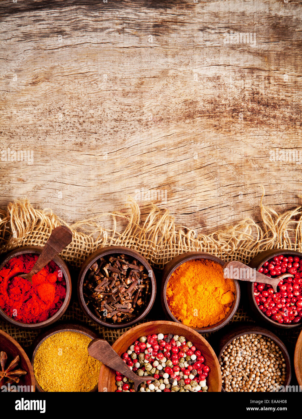 Various kind of spices in wooden bowls Stock Photo - Alamy