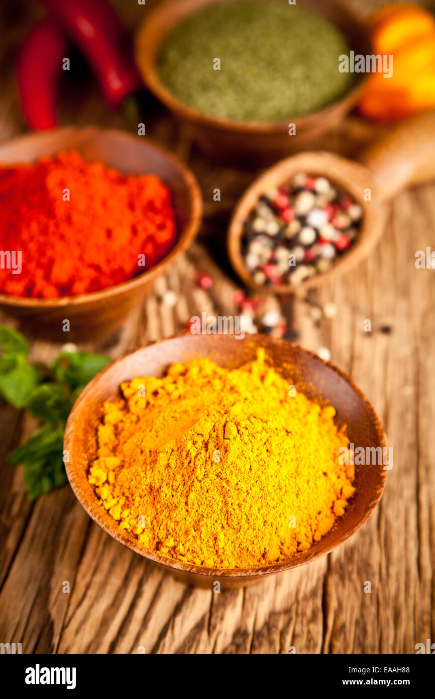 Various spices in wooden bowls Stock Photo - Alamy