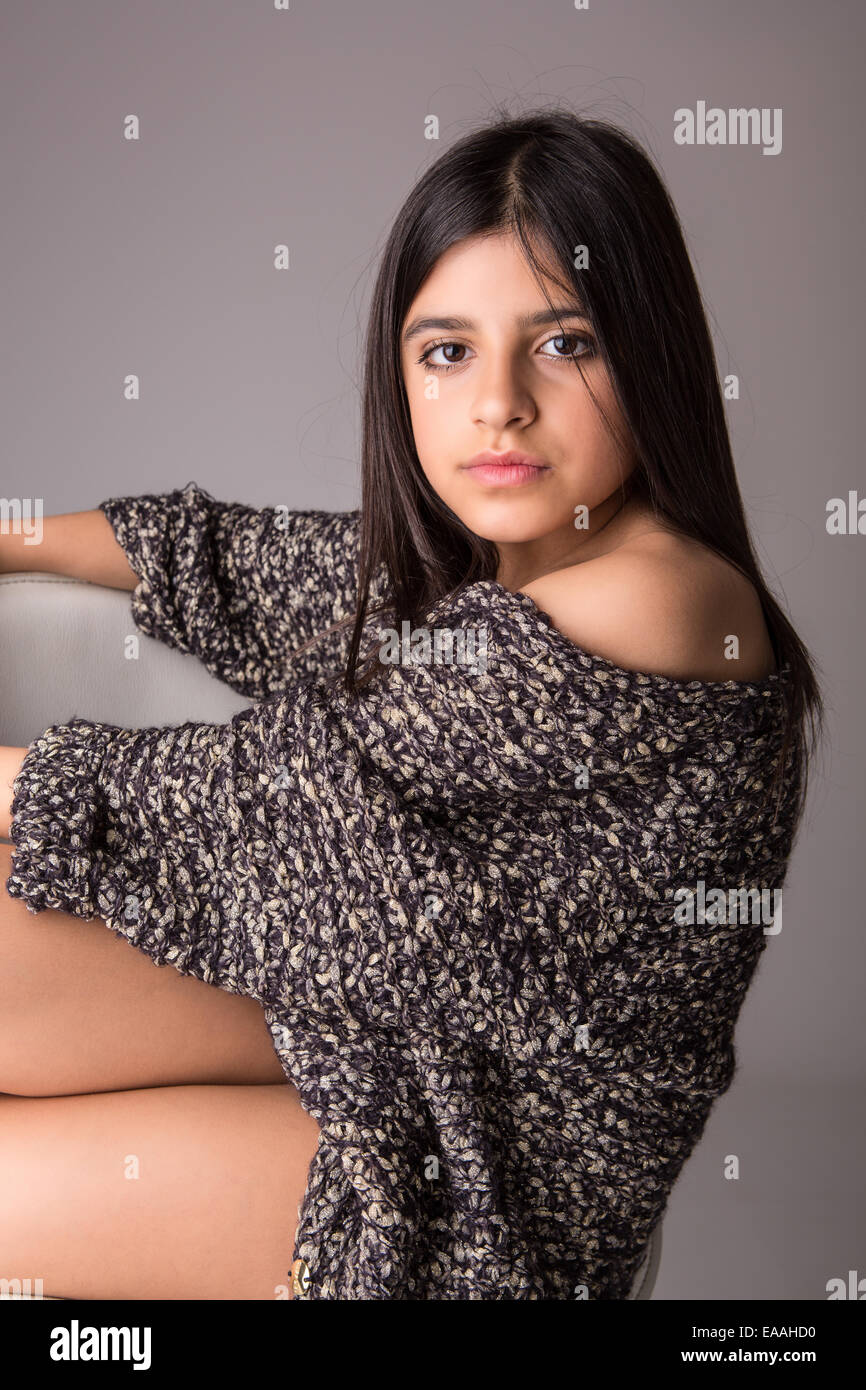 Fashion portrait of a little girl posing Stock Photo - Alamy