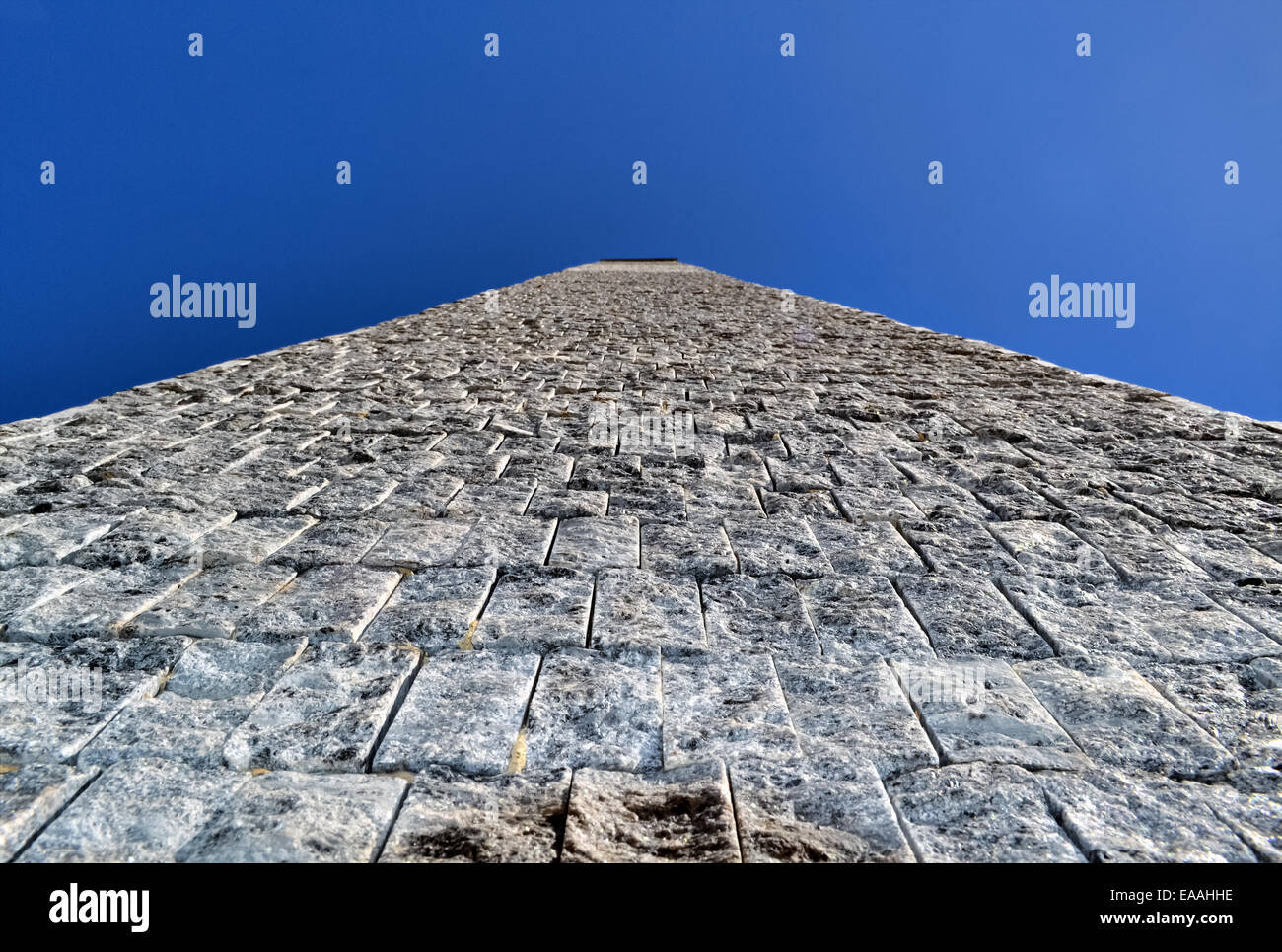 Sky and high stone tower photographed from a lower angle Stock Photo ...