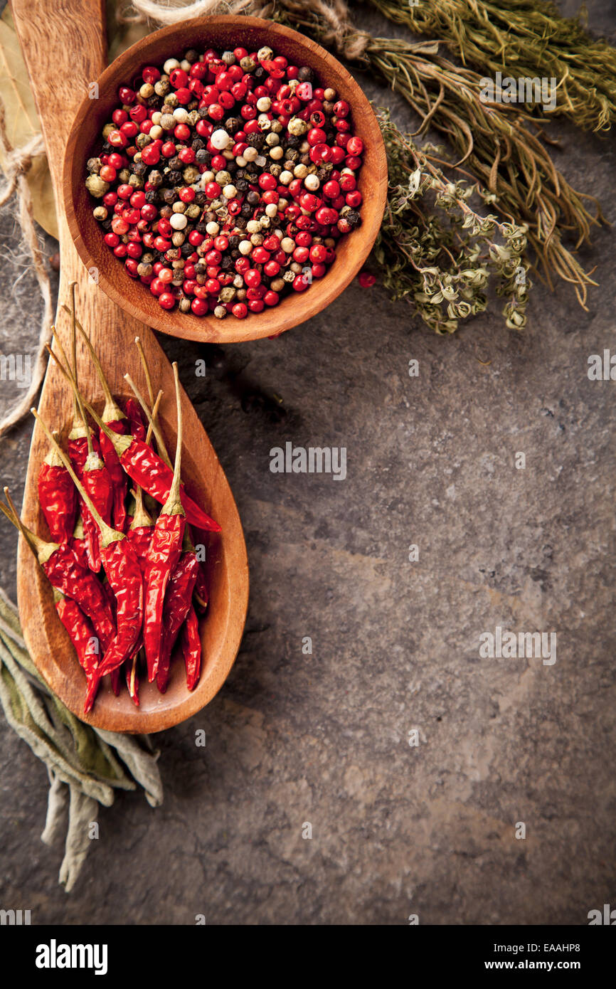 Various spices in wooden bowls on stone surface Stock Photo - Alamy