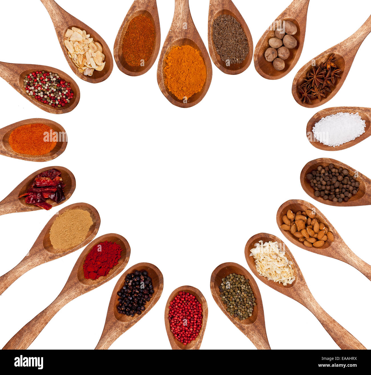 Various kinds of spices in heart shape, isolated on white background ...