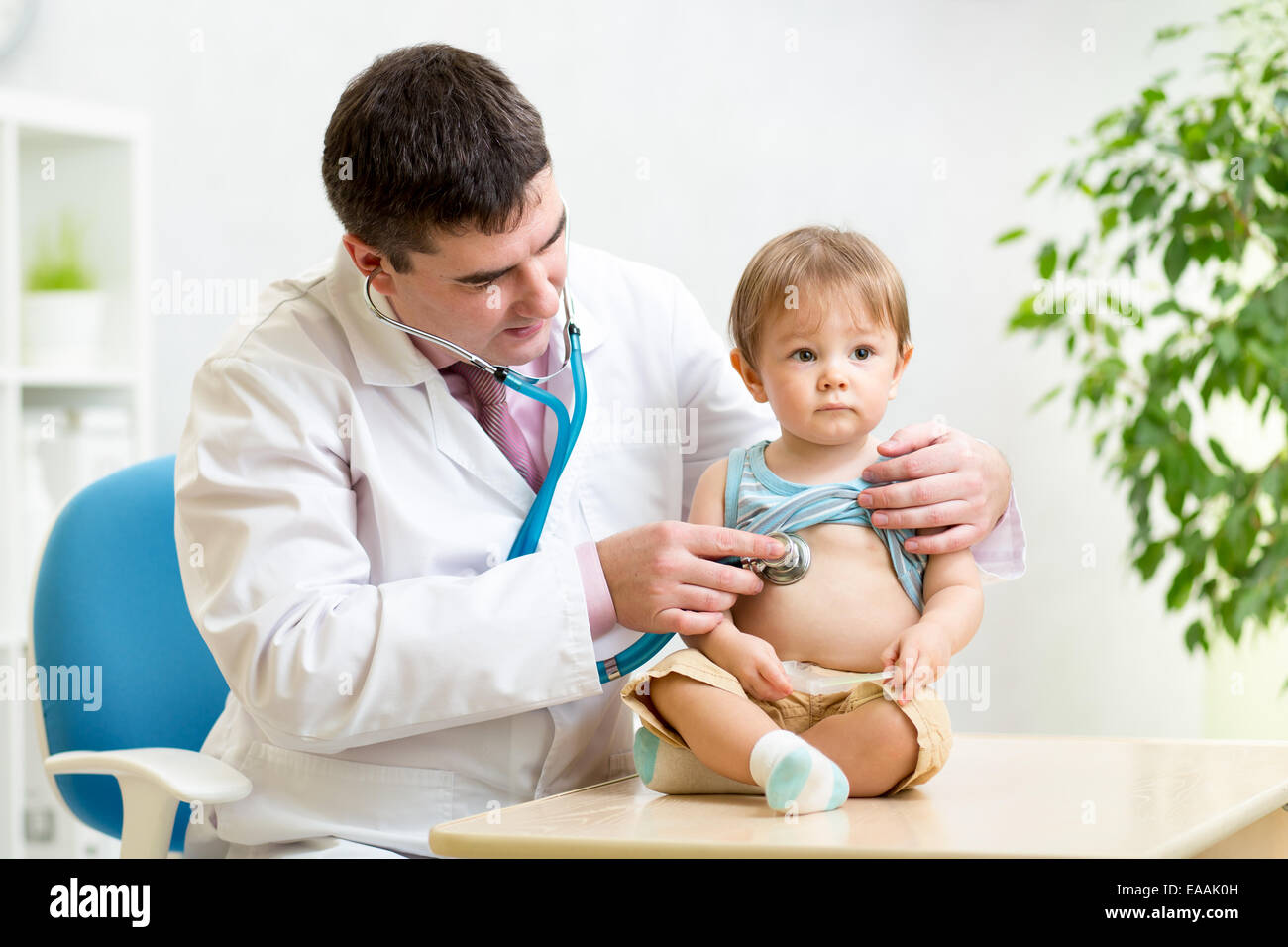doctor man examining heartbeat of kid boy with stethoscope Stock Photo ...