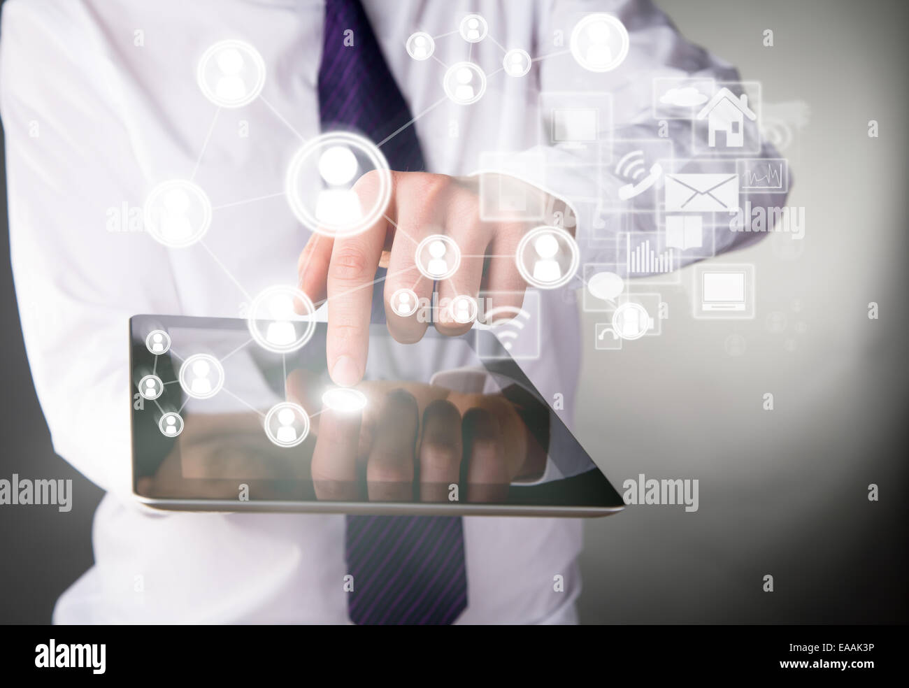 Business concept with man hand touching tablet computer. Virtual icons ...