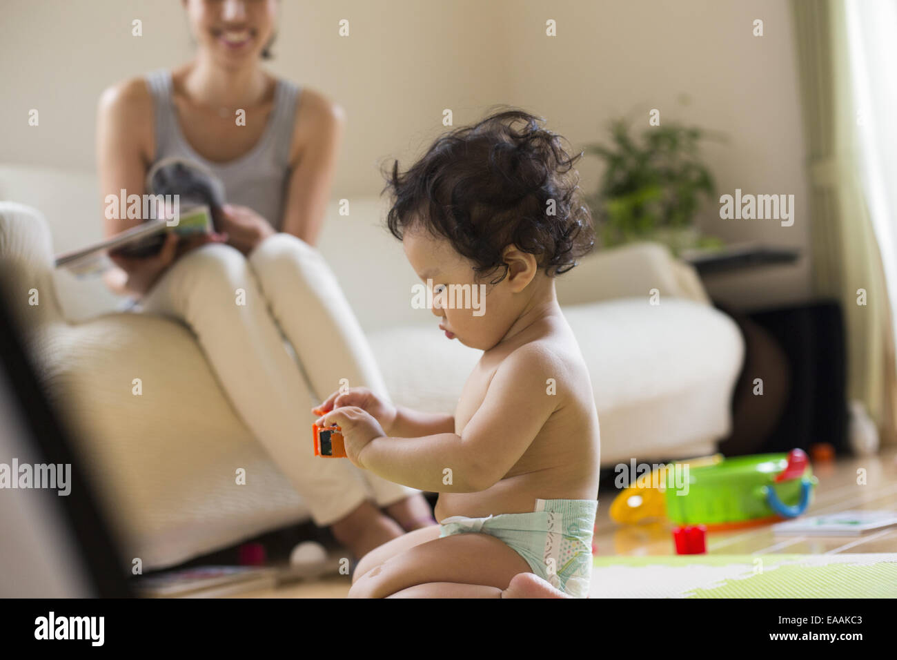 Baby boy playing indoors Stock Photo - Alamy