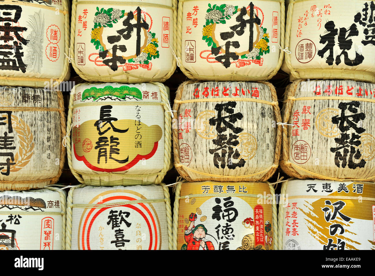 Sake and rice wine barrels stacked up outside a shrine in Japan as ...