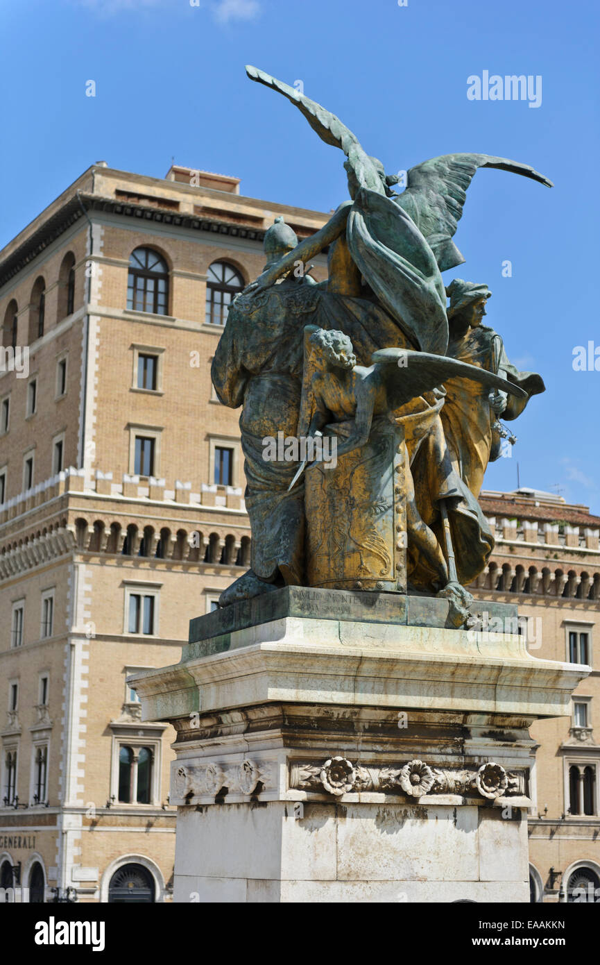 A sculpture on a pillar outside the Victor Emmanuel II white building ...