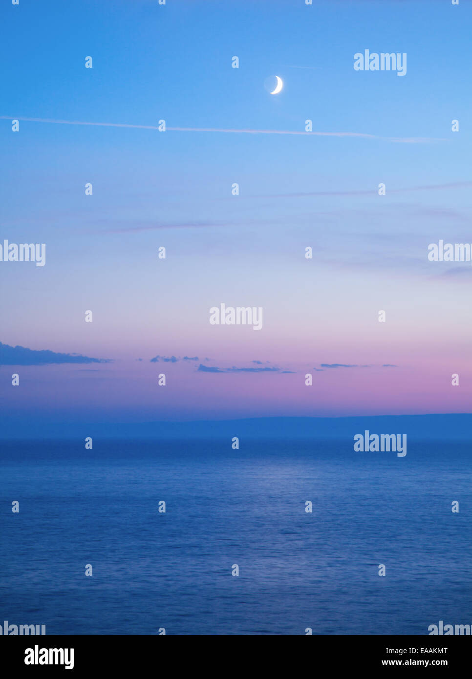 Evening landscape with sea and moon Stock Photo - Alamy