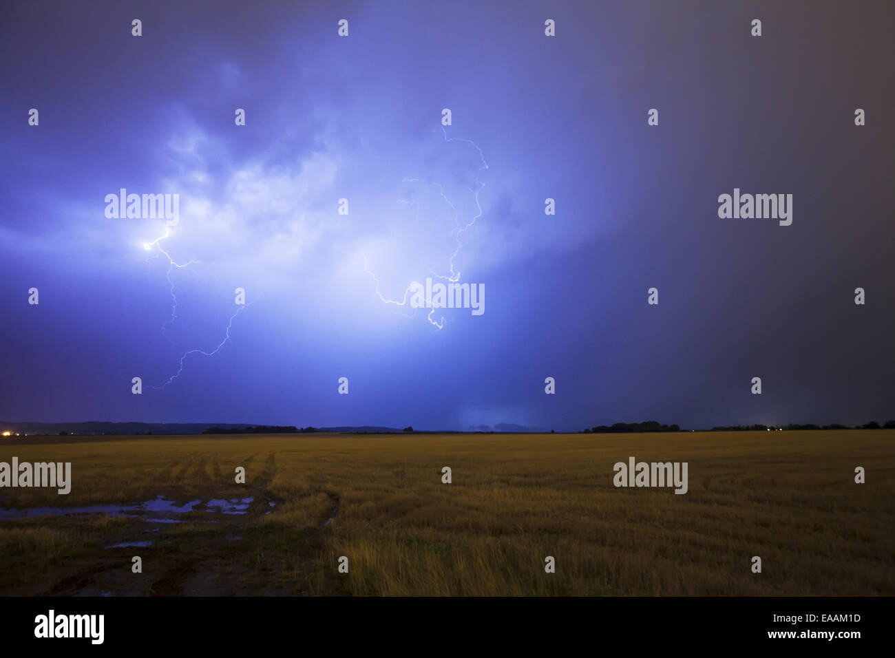 Lightning storm scenery above field Stock Photo - Alamy