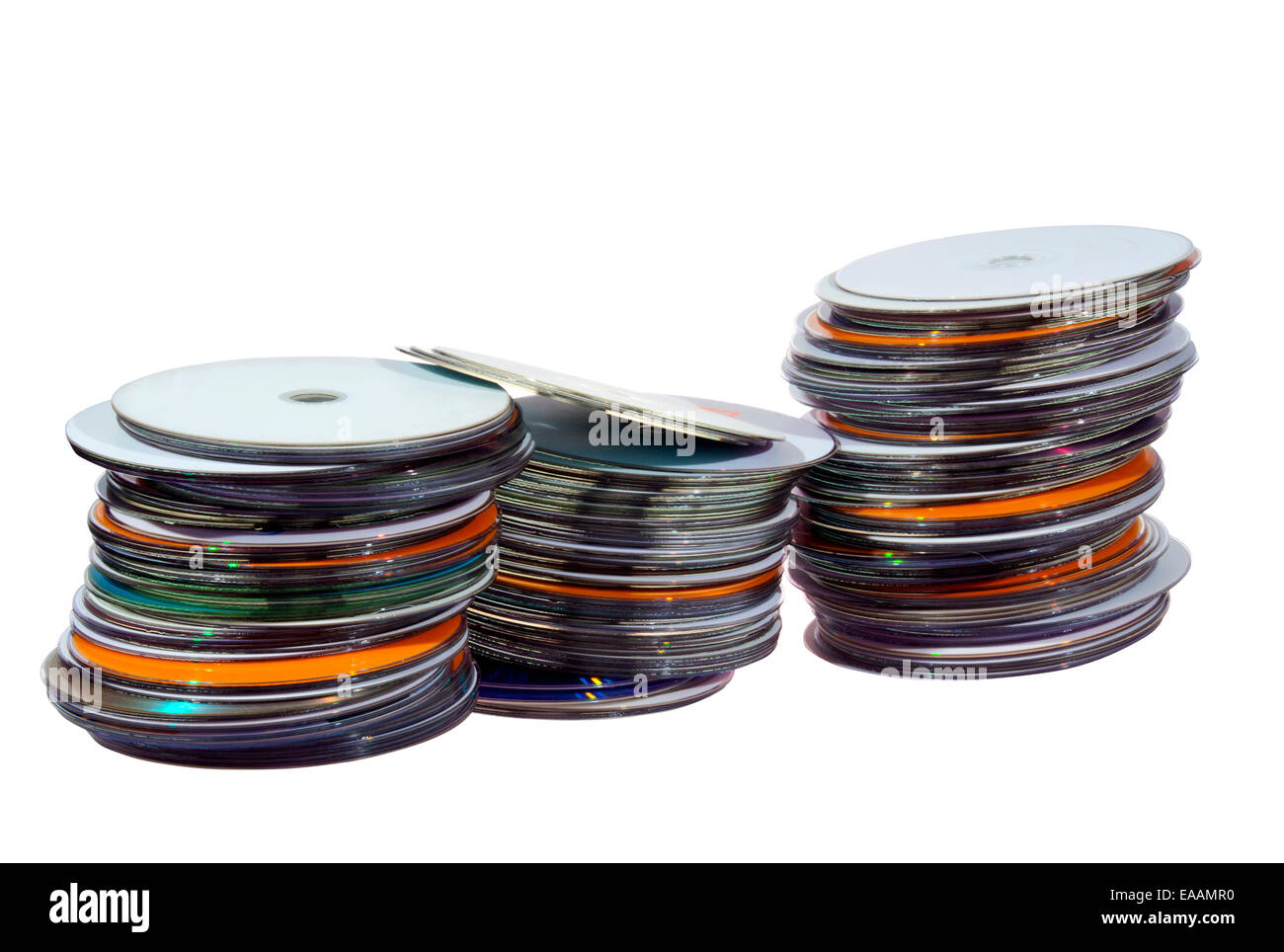 three stacks of colorful compact discs on white Stock Photo - Alamy