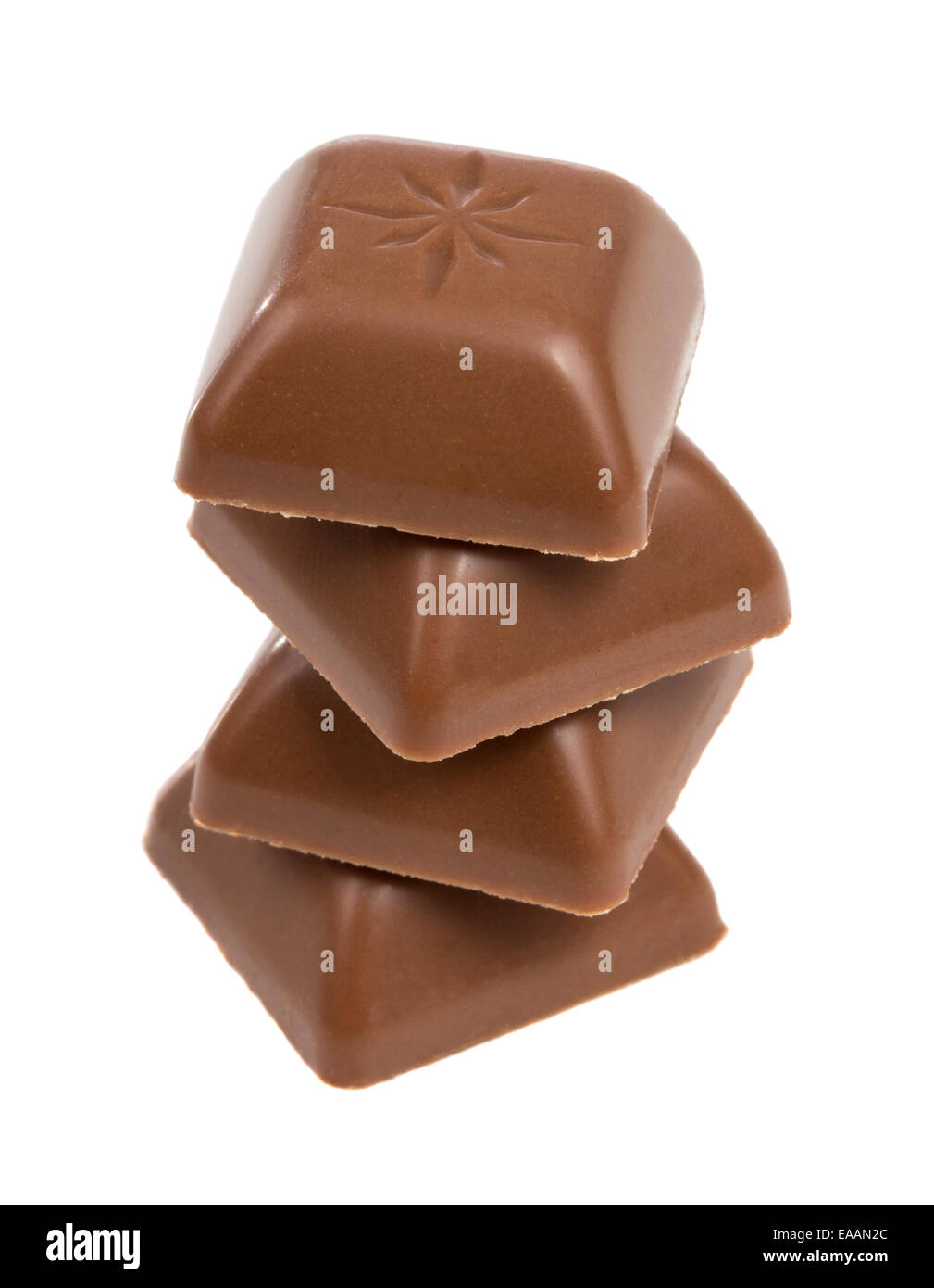 Stack of chocolate pieces on a white background Stock Photo - Alamy