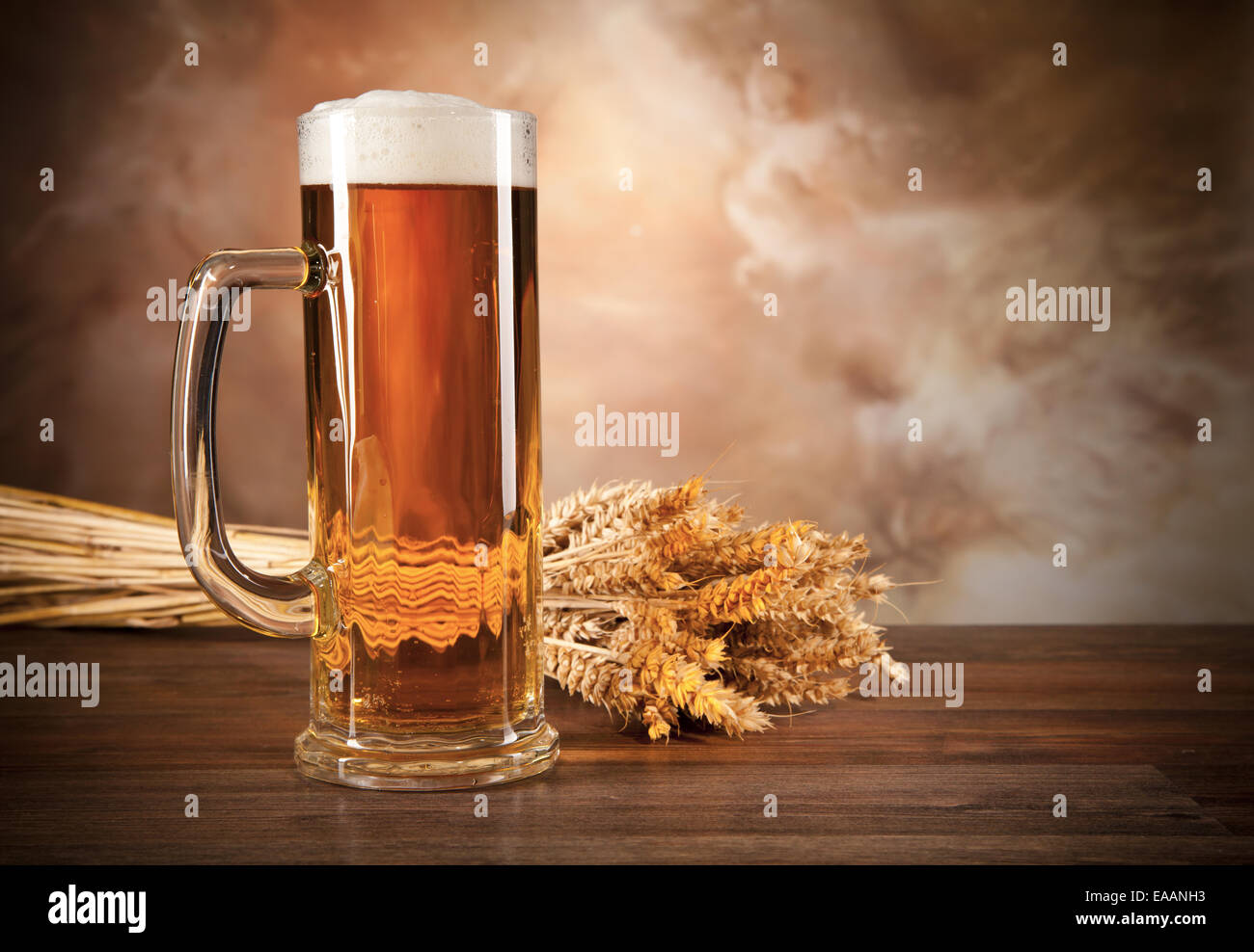 Glass of beer on wooden table Stock Photo - Alamy