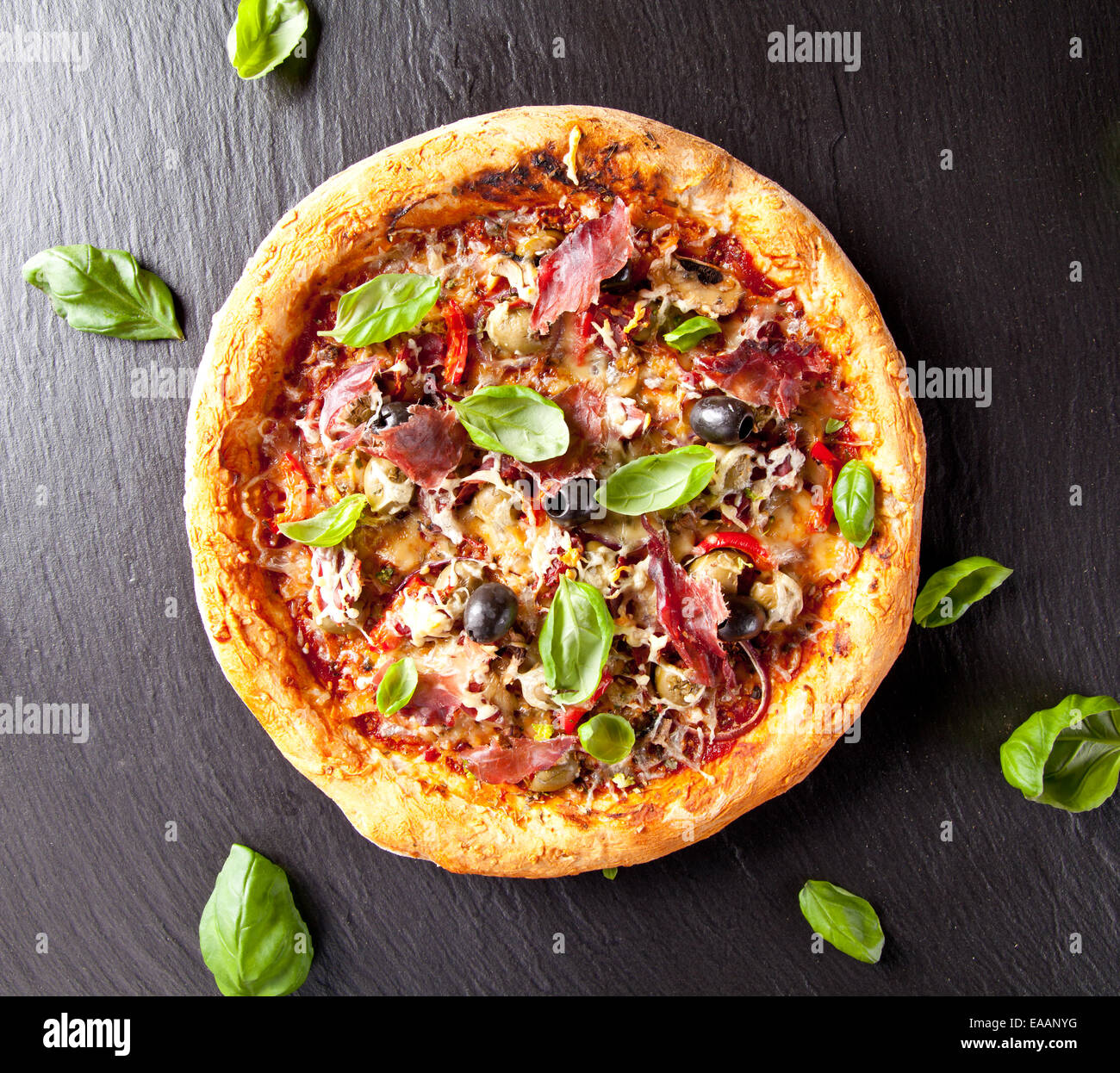 Home made fresh italian pizza with vegetable. Served on black stone ...