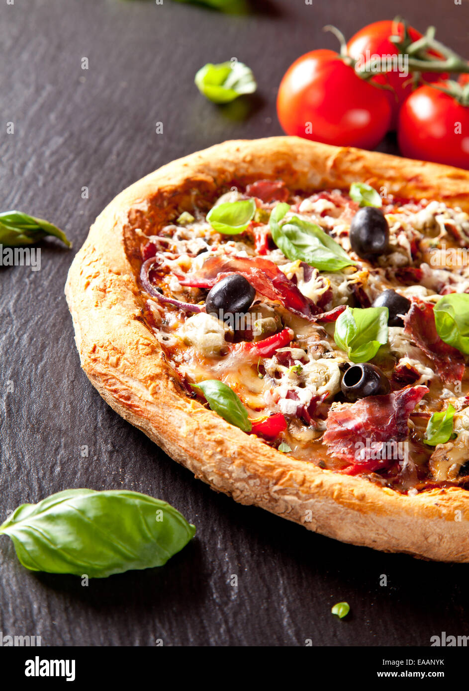 Home made fresh italian pizza with vegetable. Served on black stone ...