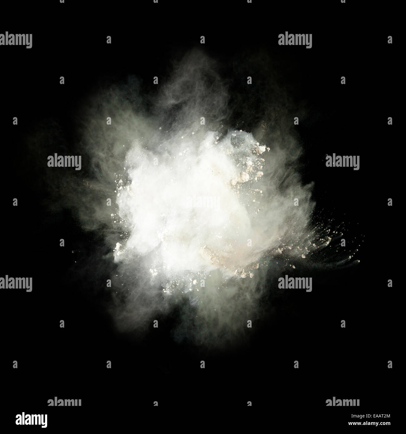 Freeze motion of white dust explosion isolated on black background ...