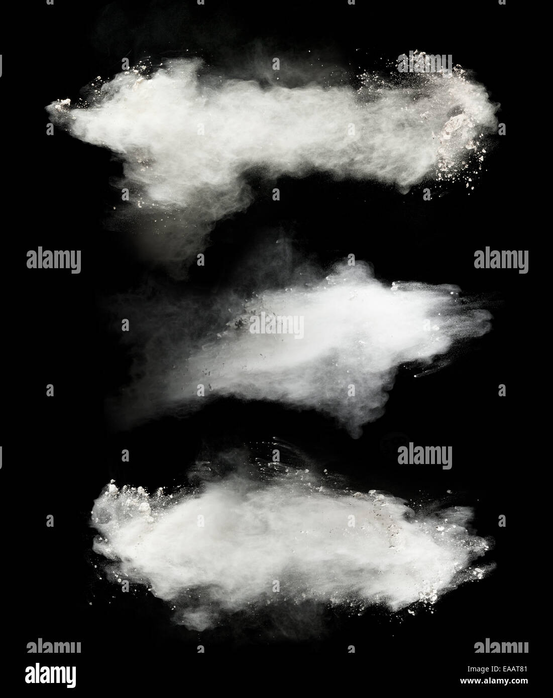 Freeze motion of white dust explosion isolated on black background ...