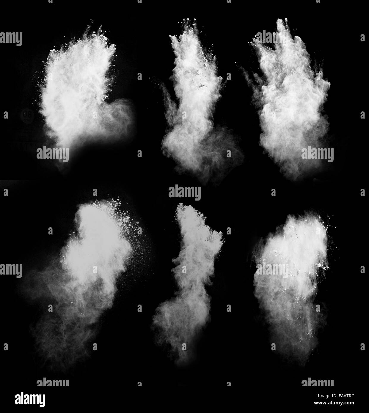 Freeze motion of white dust explosion isolated on black background ...