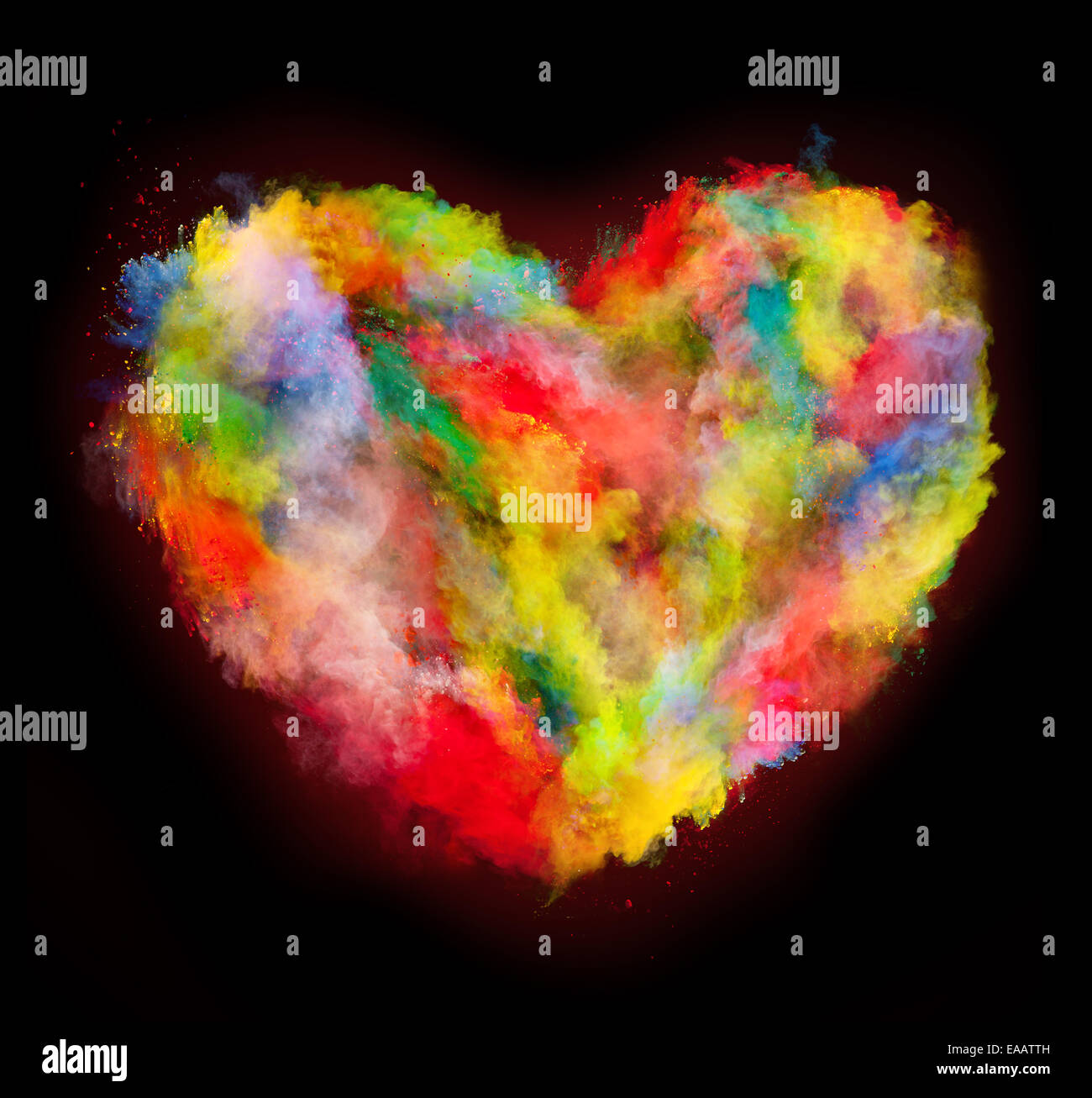 Freeze motion of colored dust heart isolated on black background Stock ...