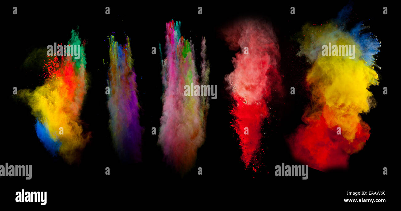 Freeze motion of colored dust explosion isolated on black background ...