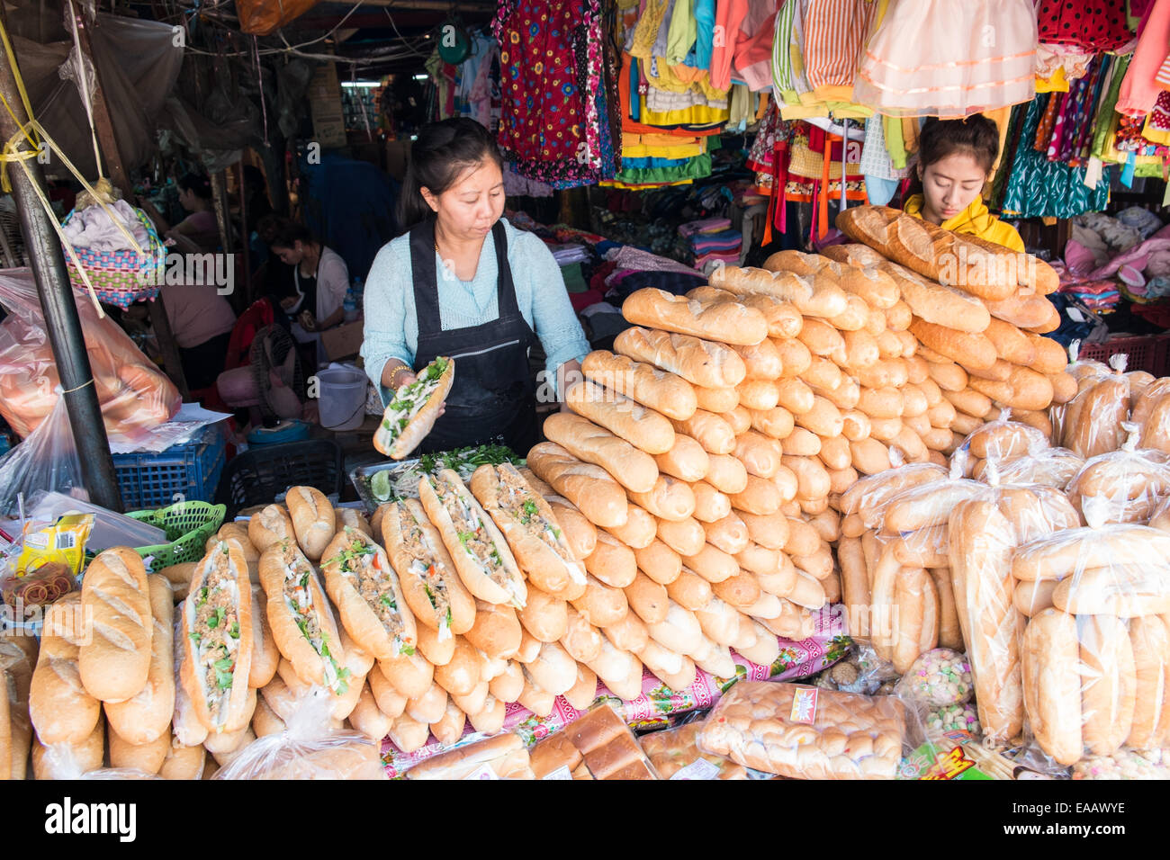 Women making sandwich filling with baguettes hi-res stock photography ...