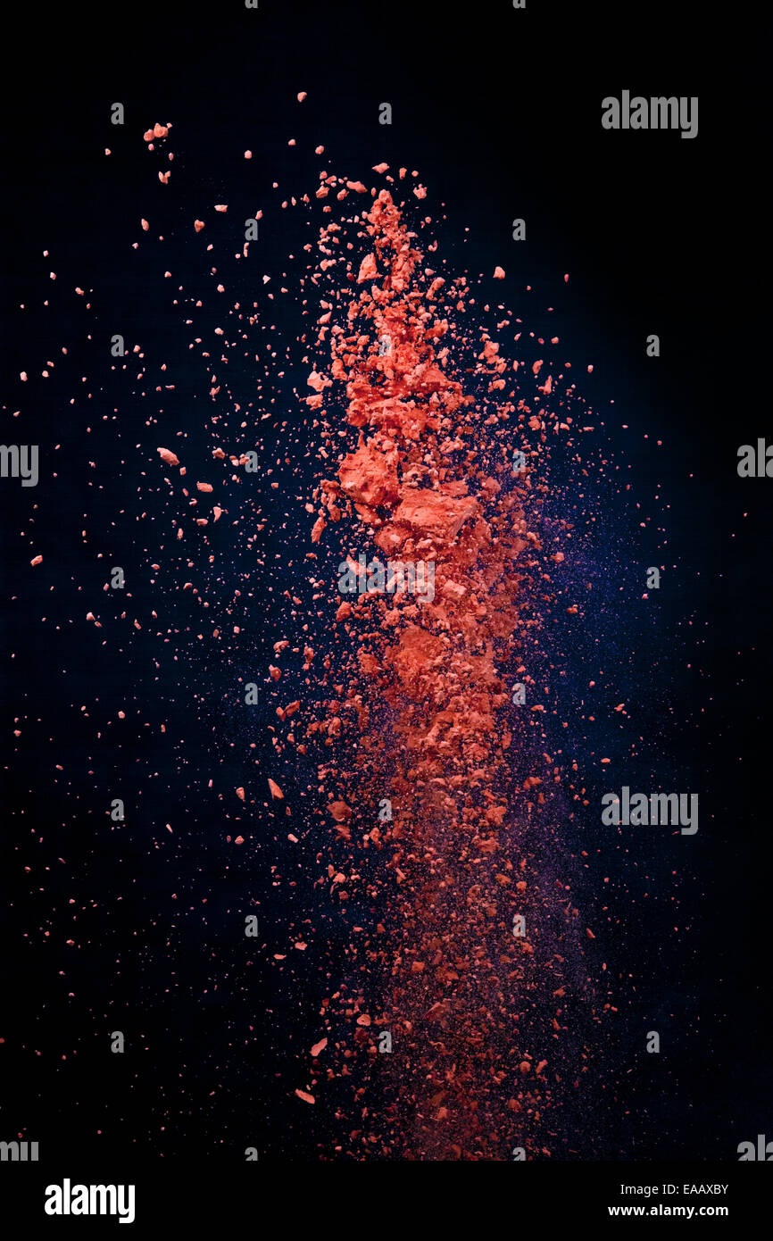 Freeze motion of colored dust explosion isolated on black background ...