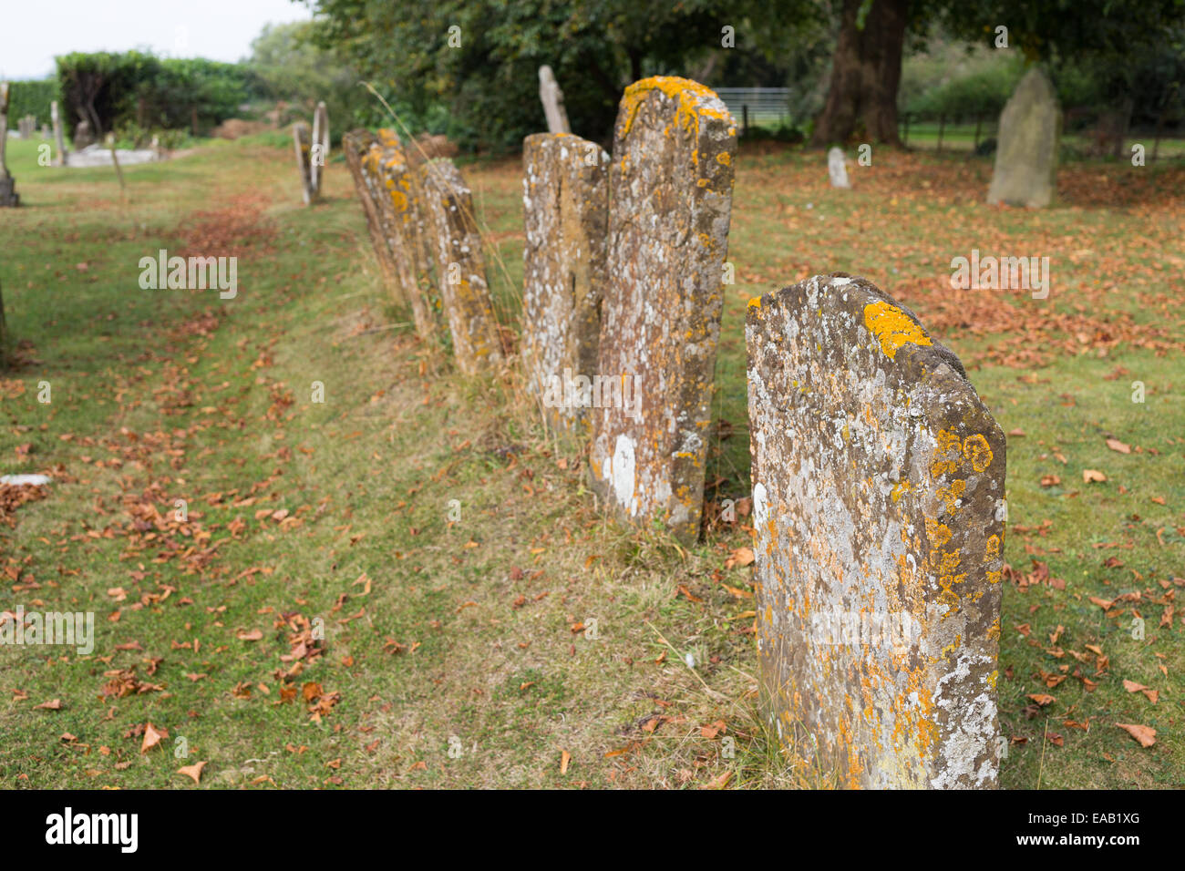 Closeup to old Gravestones at a church Stock Photo - Alamy