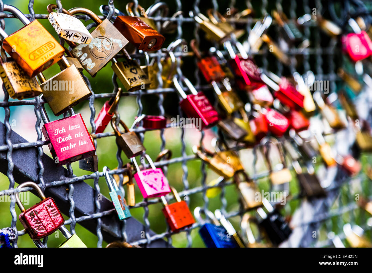 Engraved love meassage padlocks on a bridge at Riva Del Garda, Lake ...