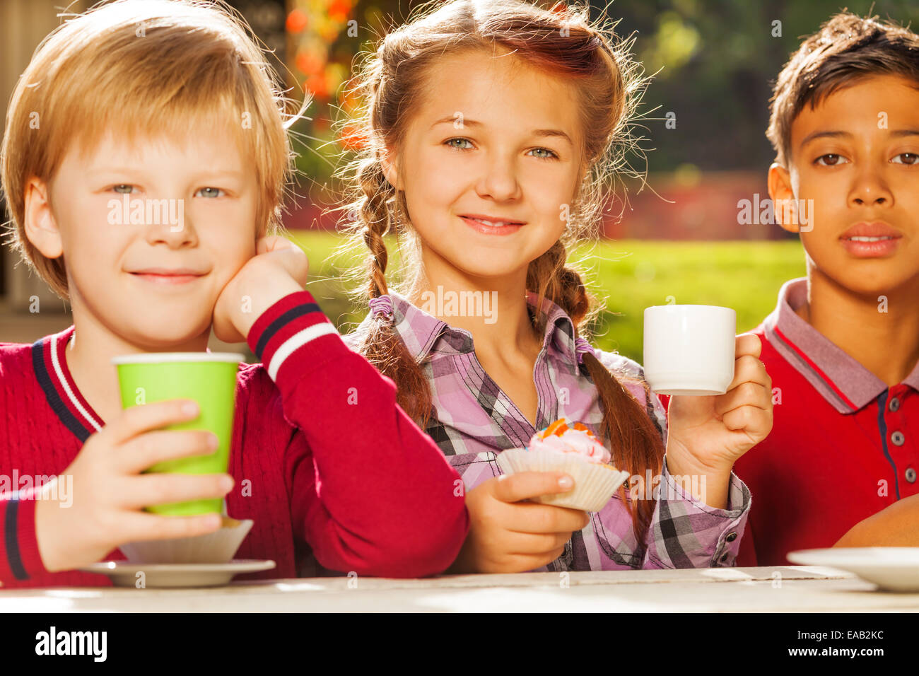 Close up view of international kids drinking tea Stock Photo - Alamy